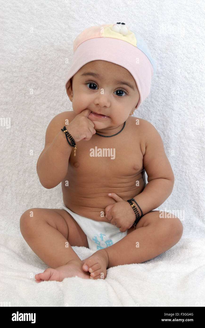 Asian girl biting finger hi-res stock photography and images - Alamy