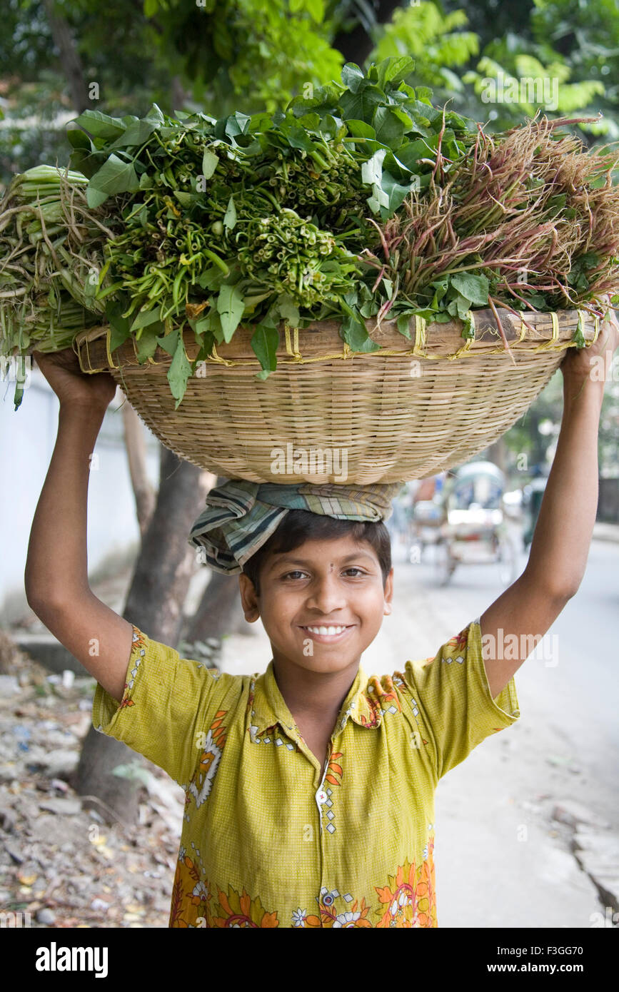 Young boy selling green vegetables on street hi-res stock photography ...