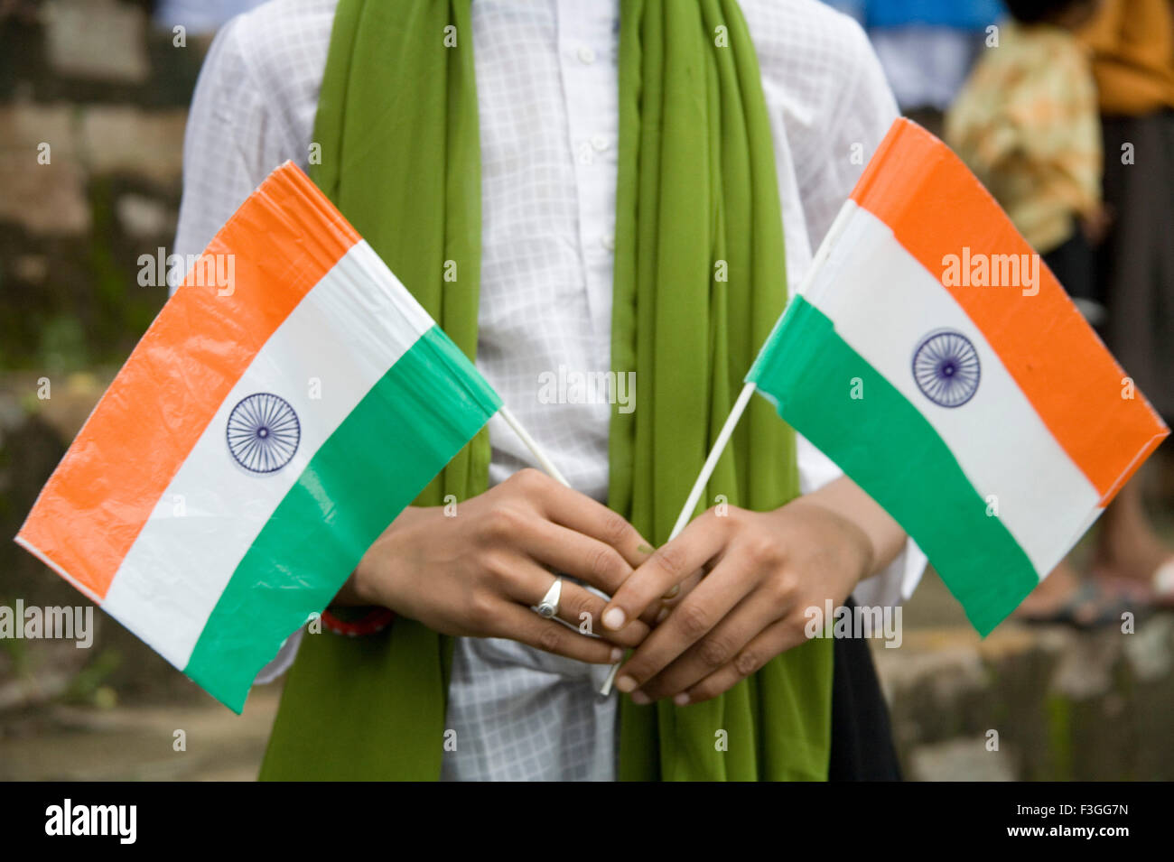 Boy holding two Indian tricolor Flag hand Independence day celebration ...