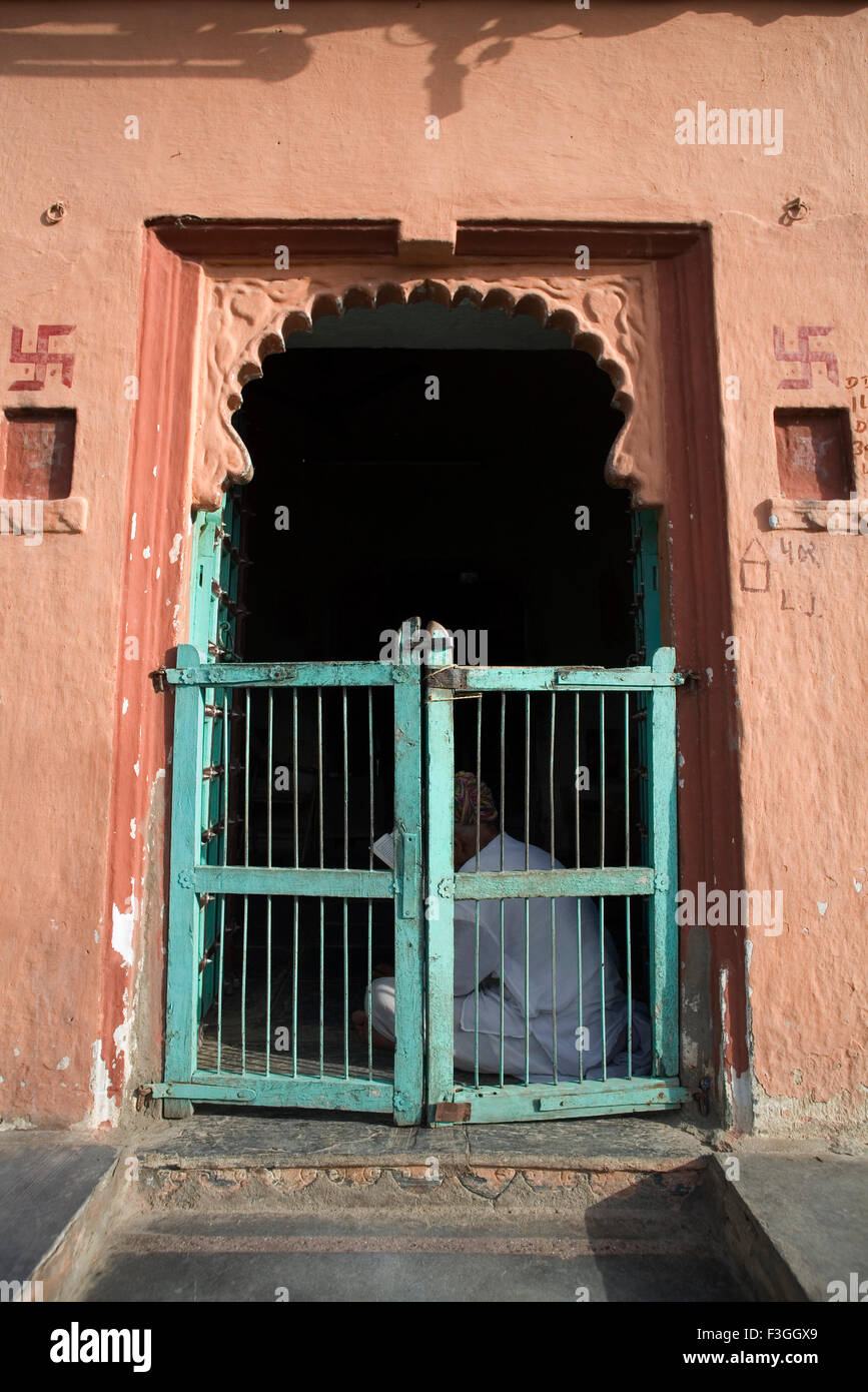 Door of a small pink temple ; Village Delwada ; Udaipur ; Rajasthan ...