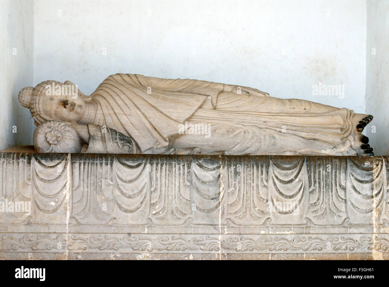 Idol of lord sleeping Buddha ; Shanti stupa ; Dauli hill ; Bhubaneswar ...