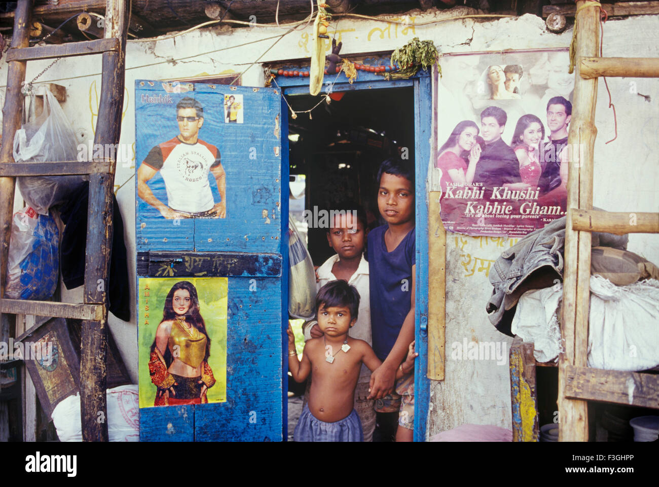 Boys posing with their popular Bollywood star posters outside their ...