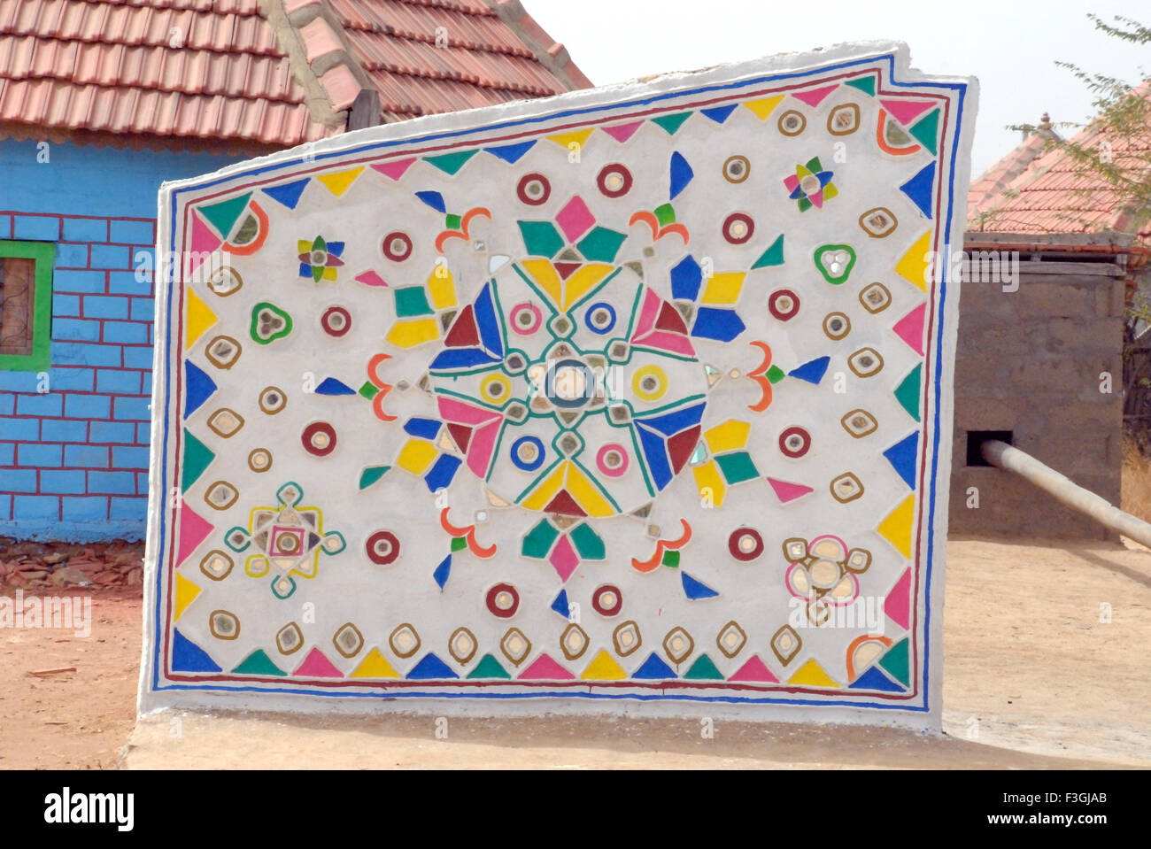 Kutchi mural work with mirror pieces on wall ; Kutch ; Gujarat ; India ...