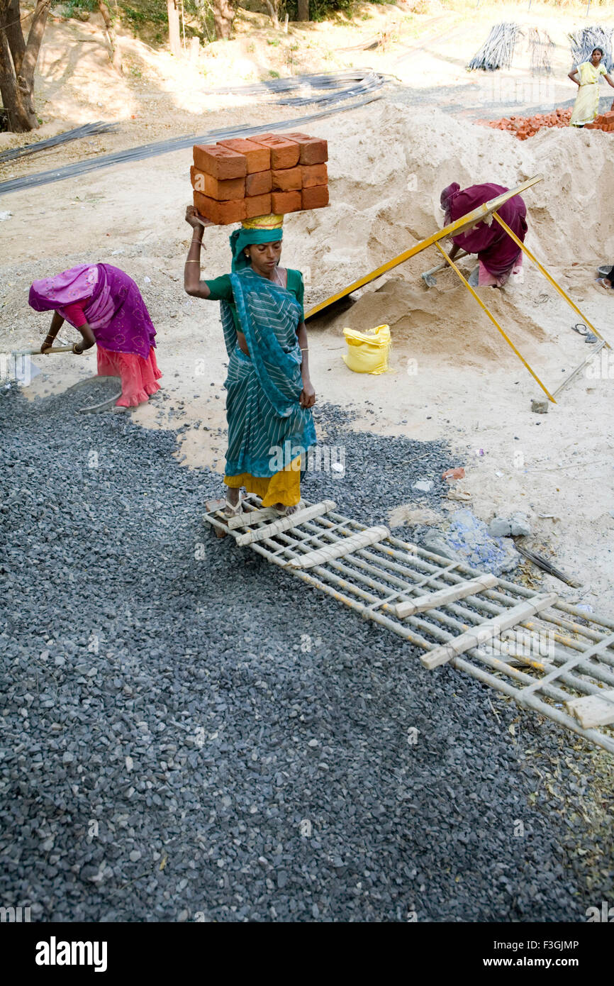 Women carrying bricks hi-res stock photography and images - Alamy