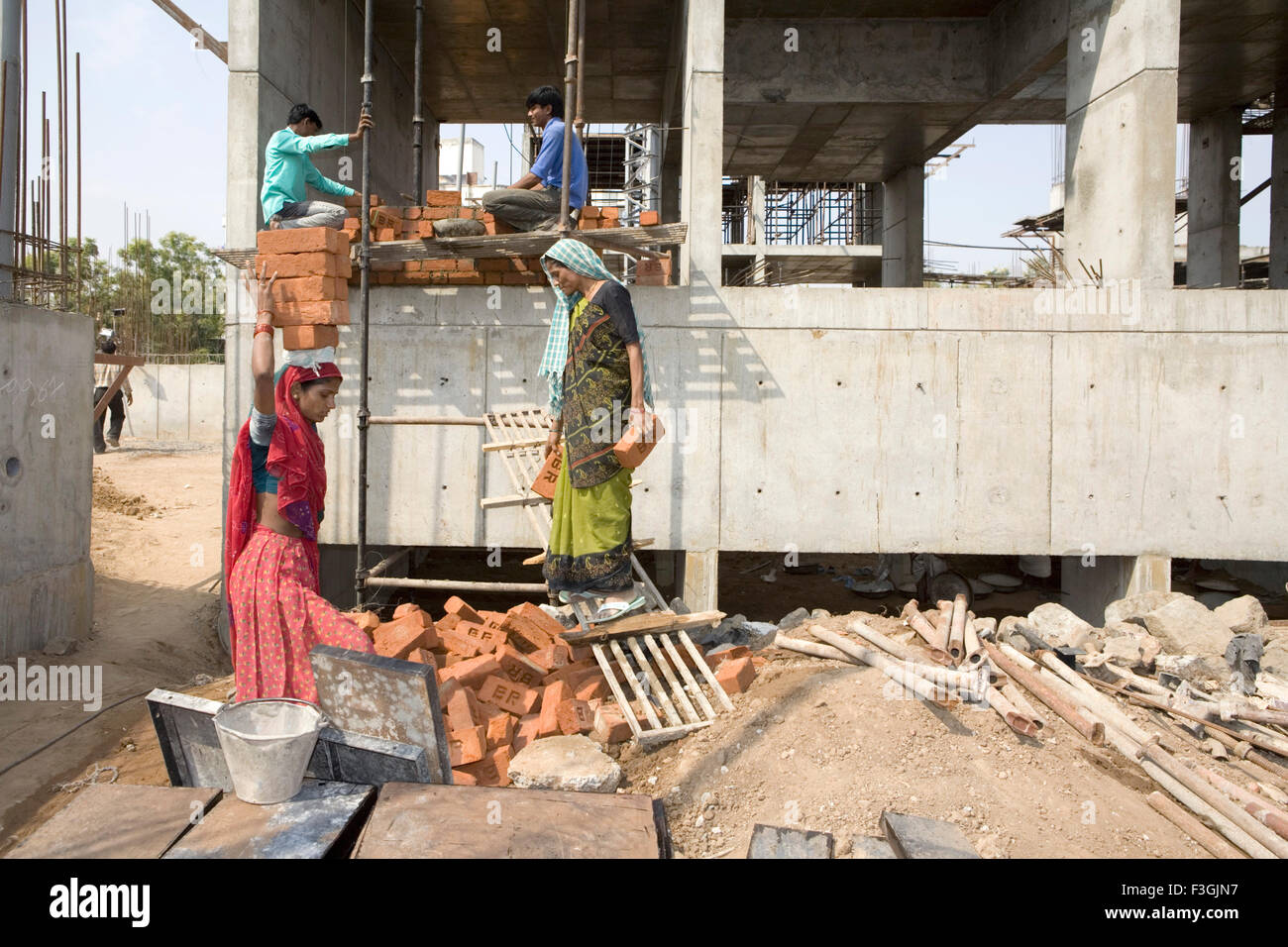 Women returning back to their work after short break at construction ...