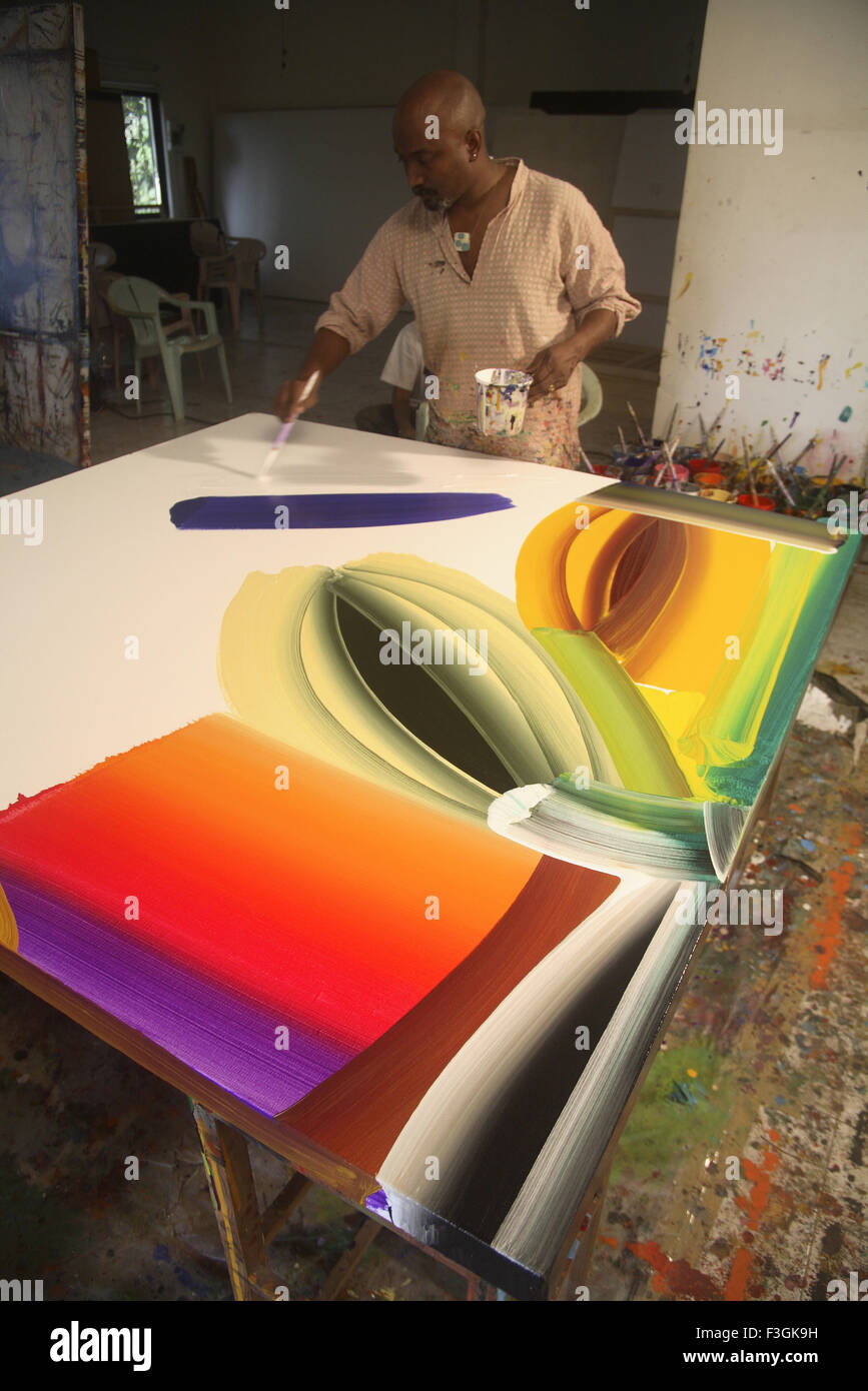 Indian contemporary artist Bose Krishnamachari in his studio working on ...