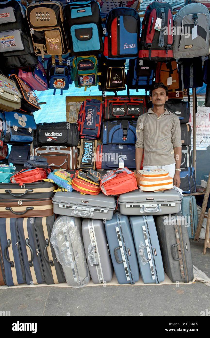 A hawker selling all kinds of bags on the roadside ; Mumbai Bombay ...