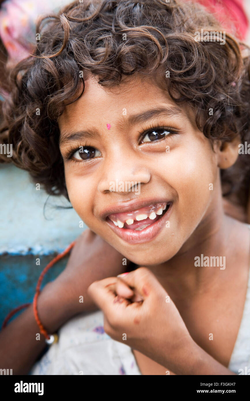 South Asian Indian Girl from Bheel tribe smiling ; Bheel basti Village ...