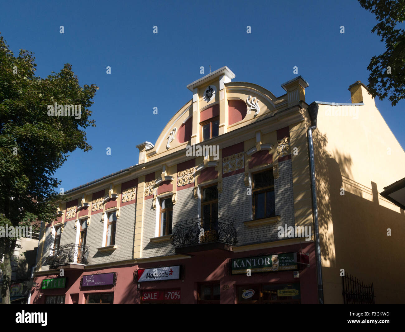 Decorated stone building amongst usual wooden buildings in famous ...