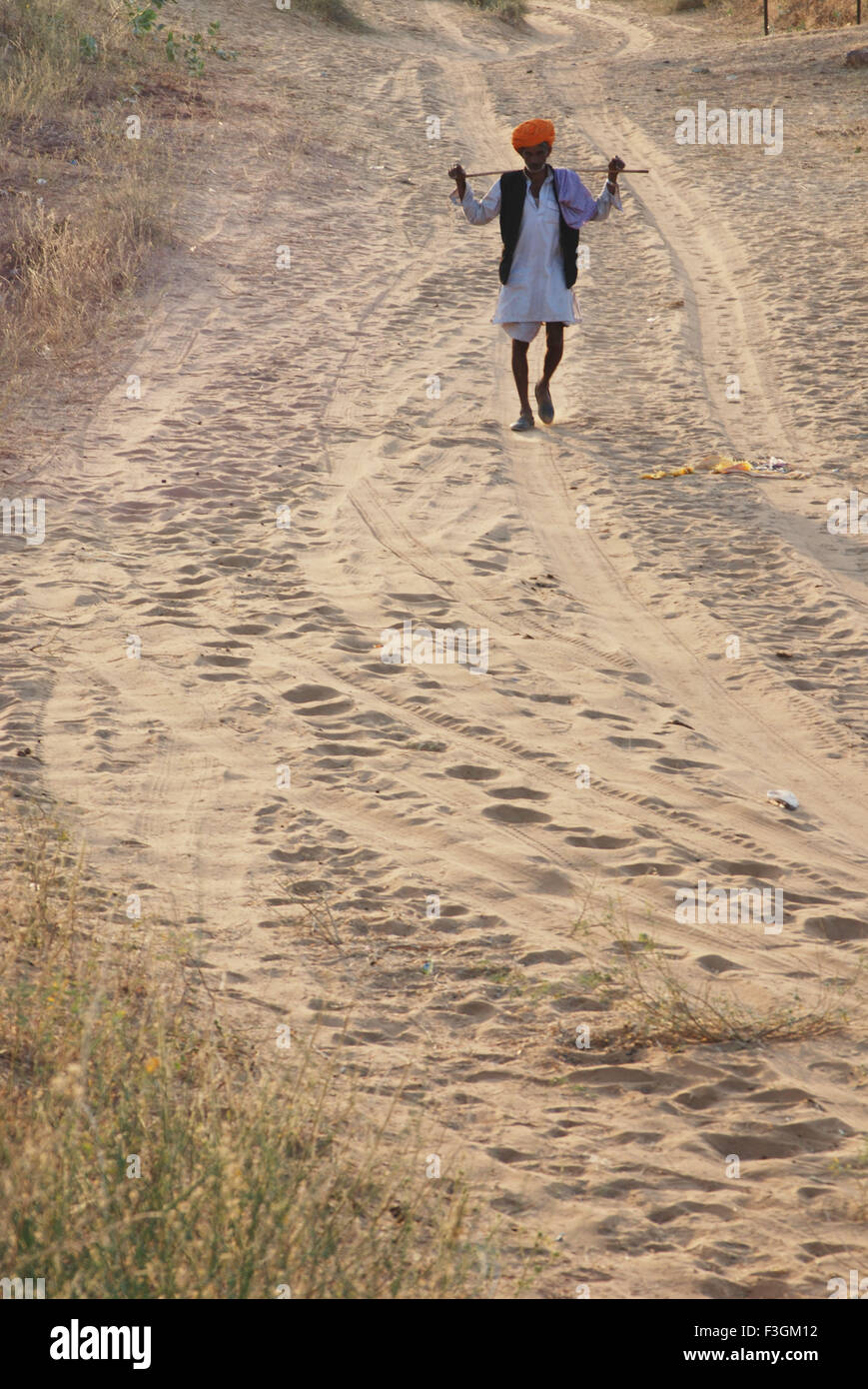 Man with walking stick hi-res stock photography and images - Alamy