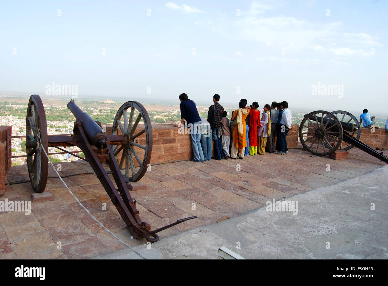 Domestic tourists on the ramp of mehrangarh fort ; Jodhpur ; Rajasthan ...