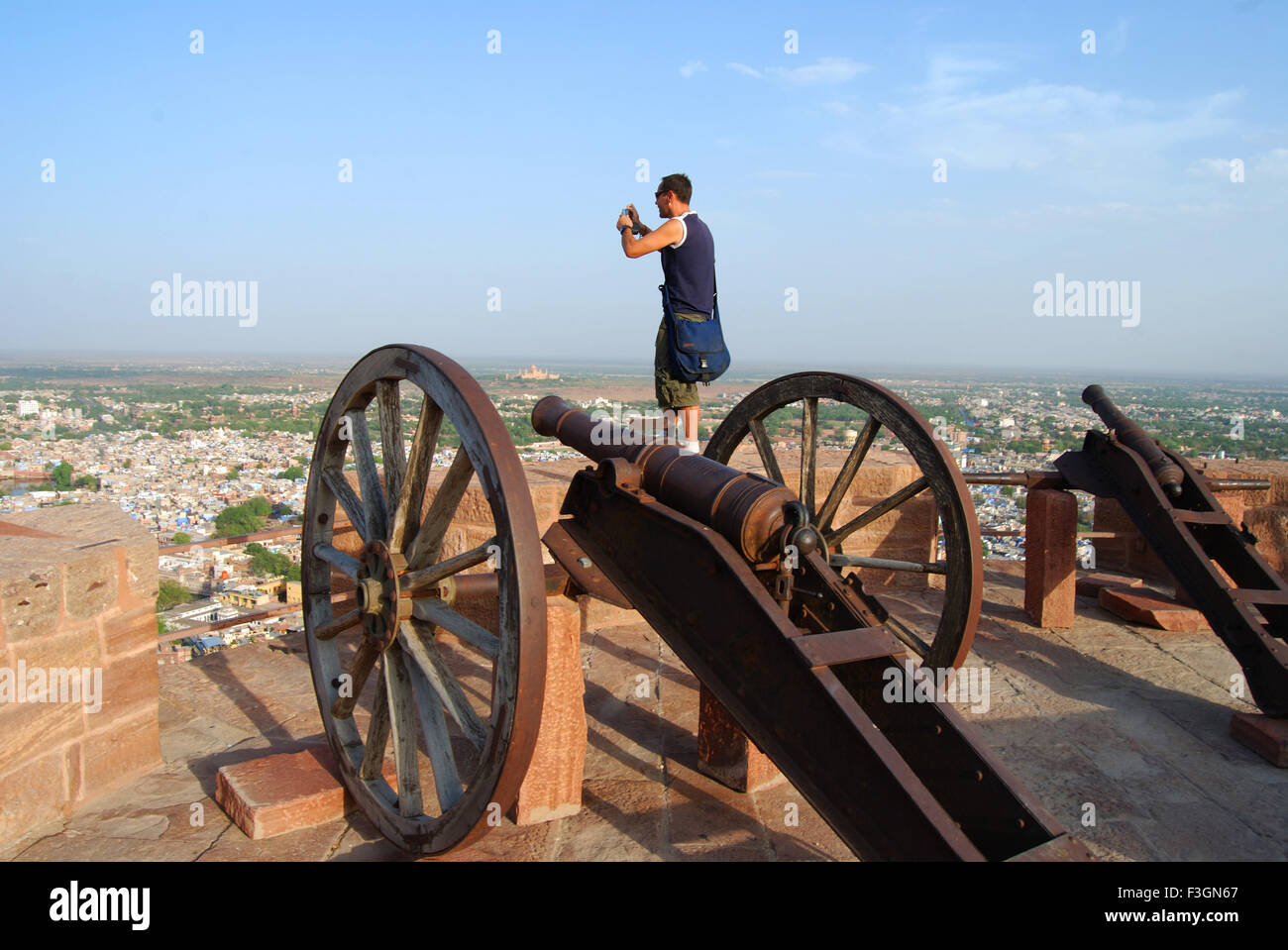 A foreign tourist on the ramp of mehrangarh fort ; Jodhpur ; Rajasthan ...