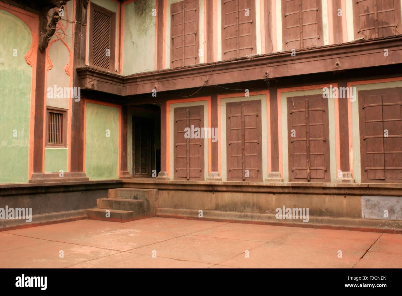 Central courtyard with a row of several wooden windows of Rajwada a ...