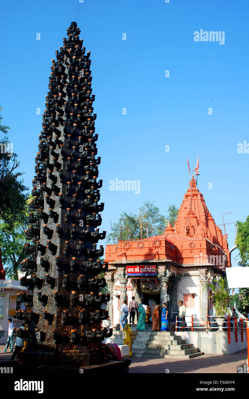 Popular harsiddhi temple with high pillar for lamps or lamp tower ...