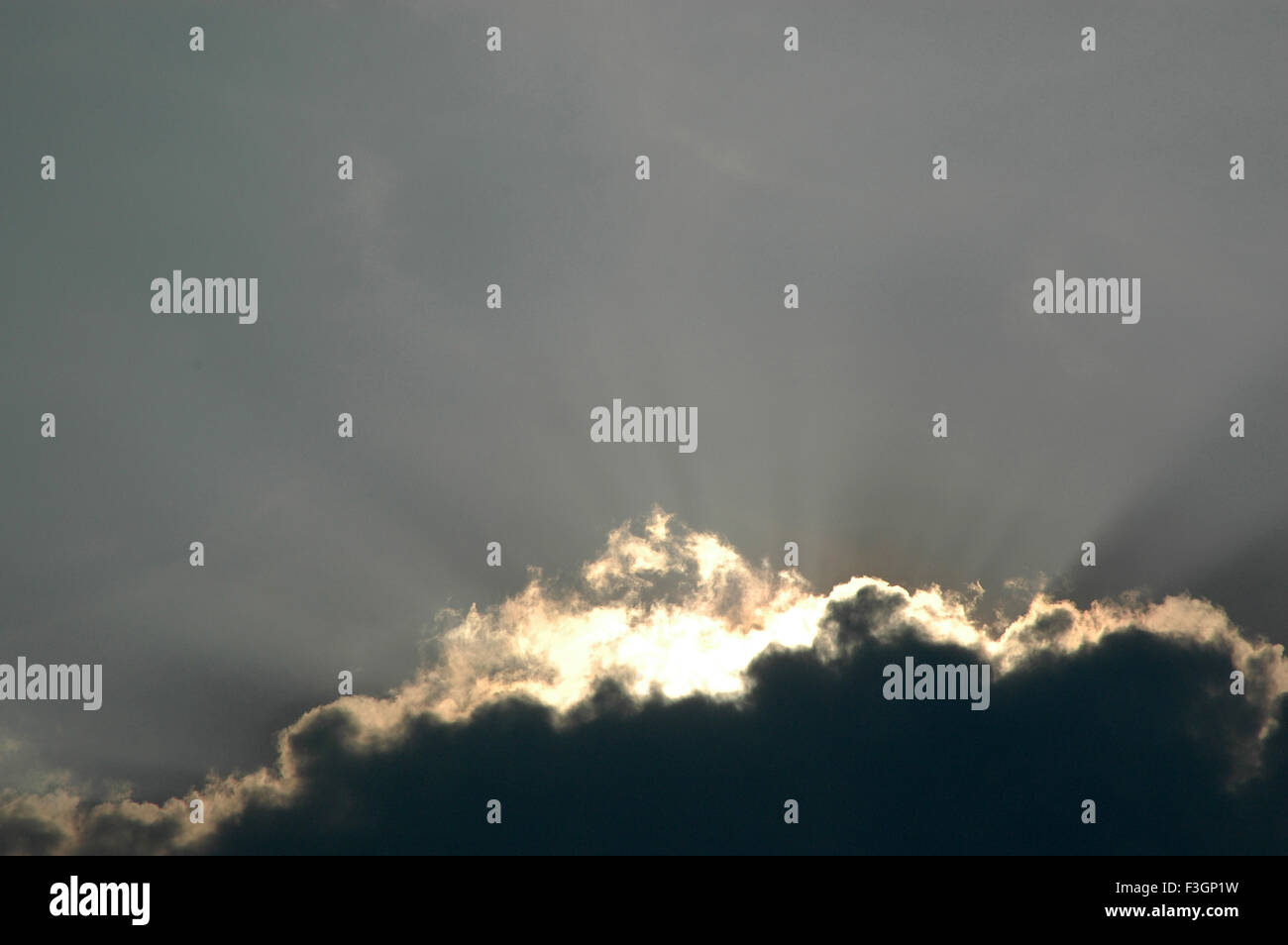 cloud with silver lining, sun hiding behind clouds, sun rays, sunlight ...