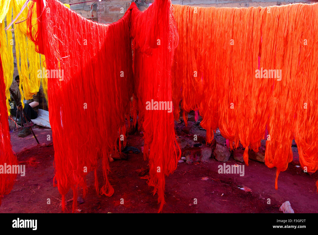 Silky thread after dye for making silky garlands Stock Photo - Alamy