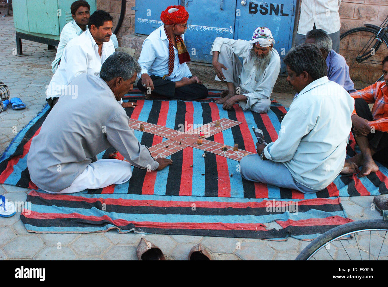 Men playing chausar ancient game chopad ; Jodhpur ; Rajasthan ; India ...