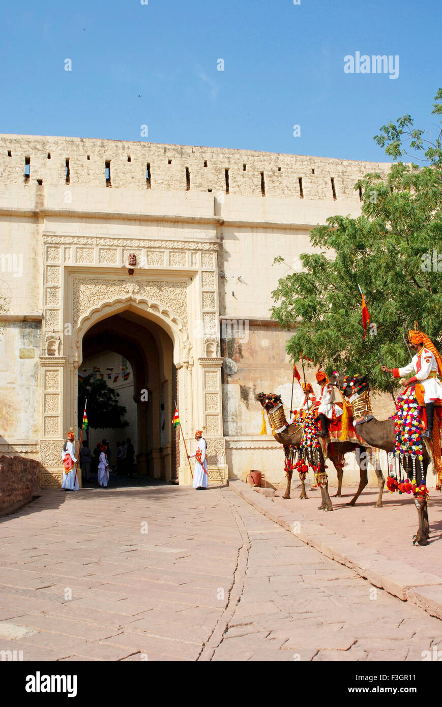 Guards on camel at Mehrangarh fort gate ; Jodhpur ; Rajasthan ; India ...