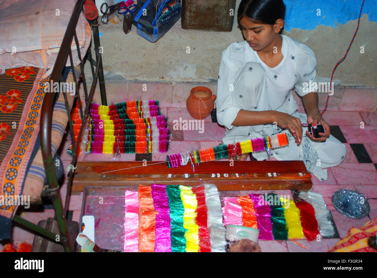 Girl making silk garland ; Jodhpur ; Rajasthan ; India Stock Photo - Alamy