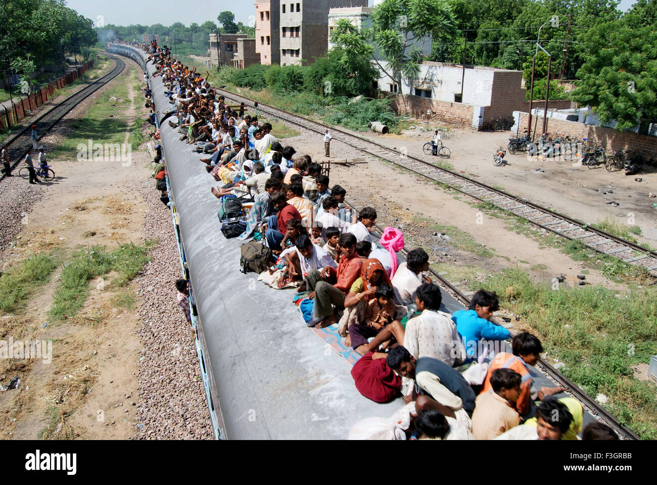 People sitting on roof of train ; Jodhpur ; Rajasthan ; India Stock ...