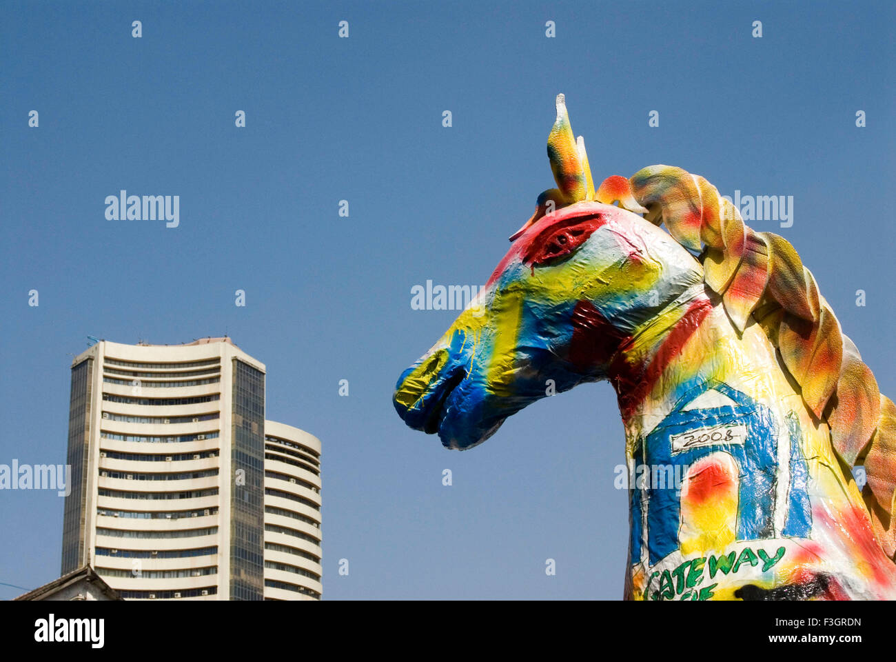 Coloured horse install in Kalaghoda festival on background of BSC ...