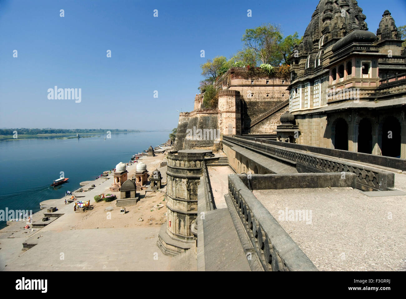 Chhatris and temples palace and ghats at bank of river Narmada ...