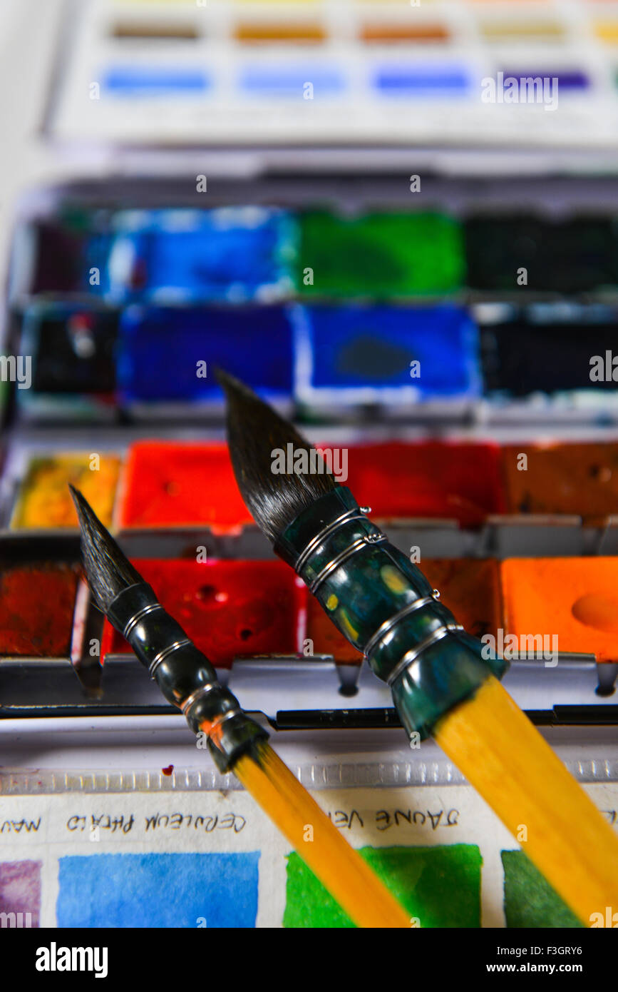 Box of watercolors with two brushes Stock Photo - Alamy
