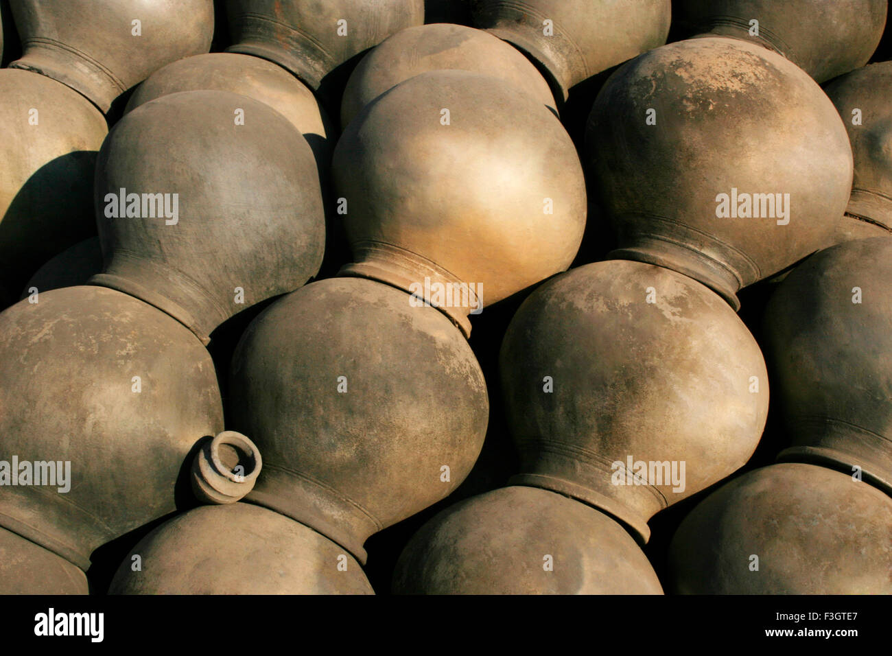 Stacked earthen pots hi-res stock photography and images - Alamy