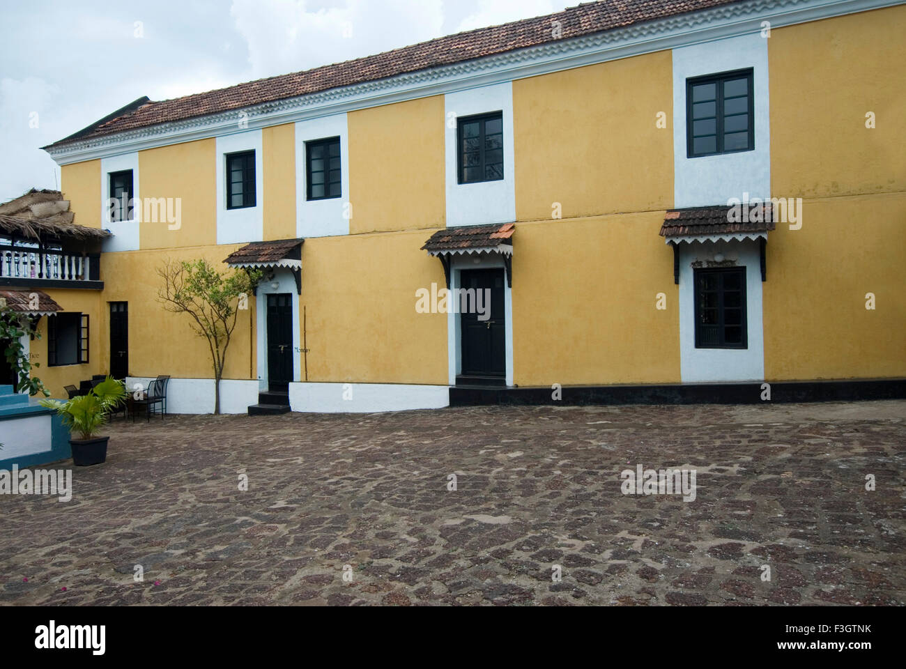 Yellow portugiz style building in terekhol fort ; state Goa ; India ...