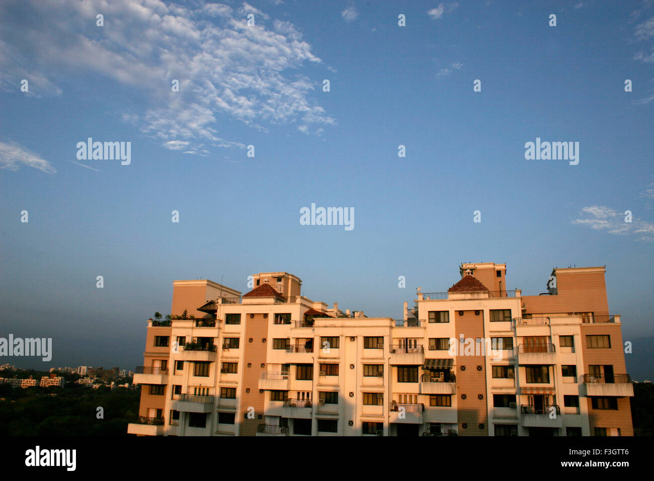 Residential building with modern architecture glowing in early morning ...