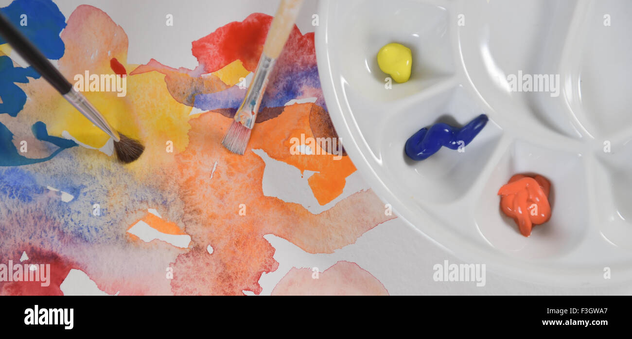 Artist's hand applying paint gouache on the drawing sheet Stock Photo ...