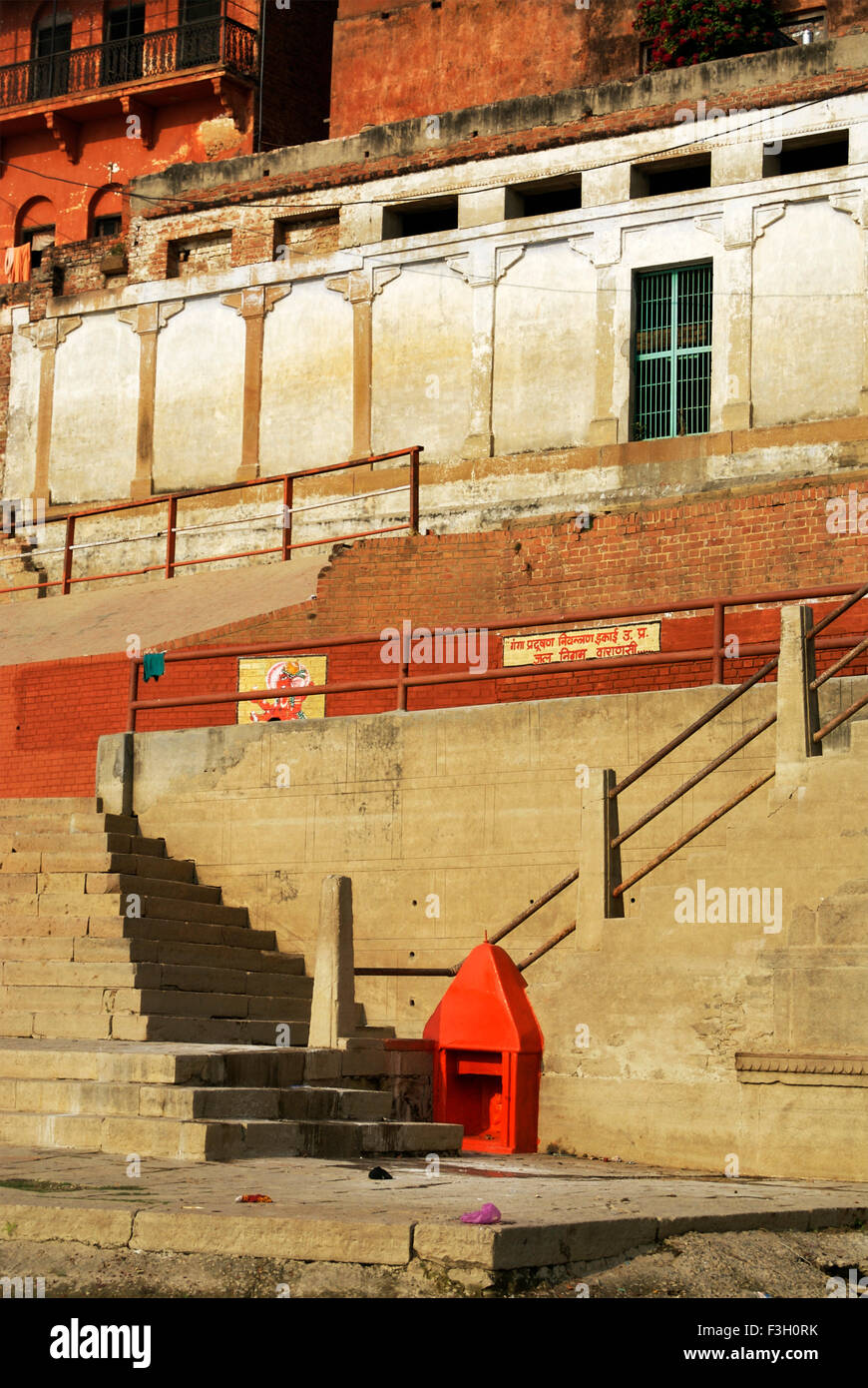 Small orange color temple on ghat of holy Ganga river ; Varanasi ...