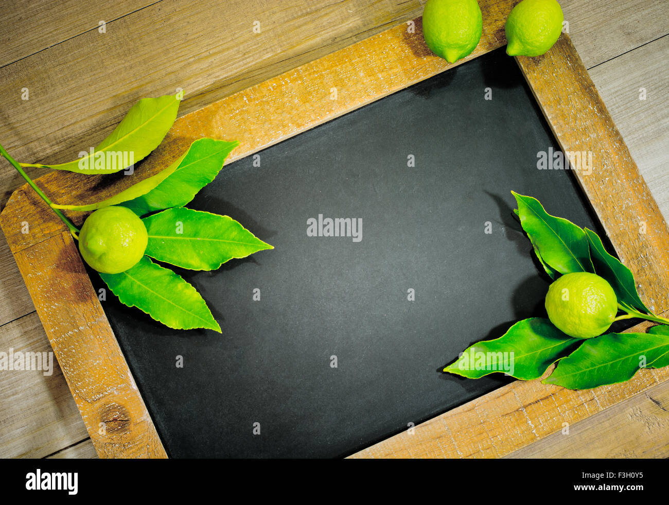 lemon leaves and citrus on a slate board Stock Photo - Alamy