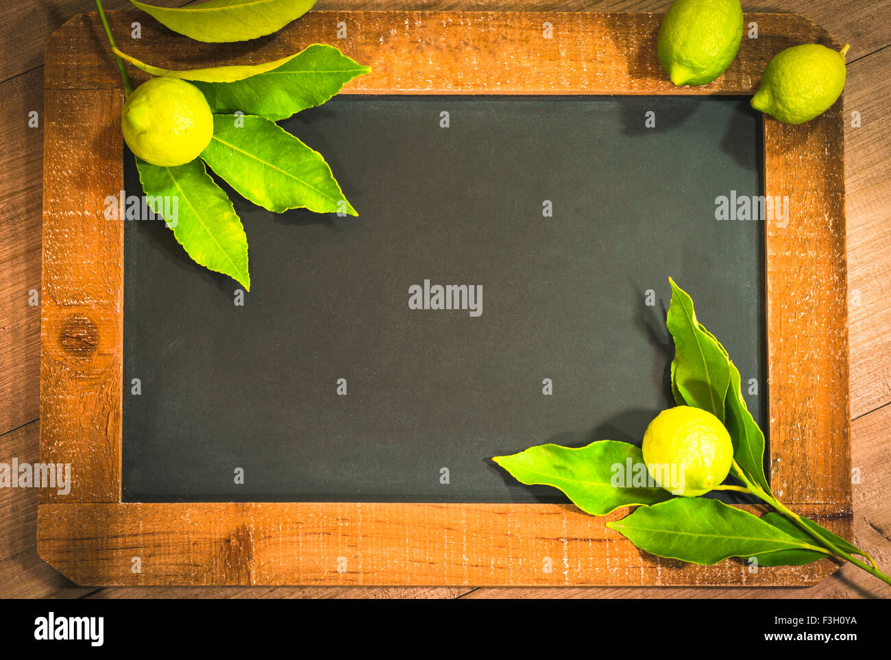 lemon leaves and citrus on a slate board Stock Photo - Alamy