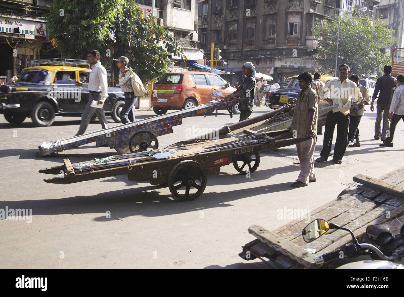 Man pulling hand cart ; Sardar Vallabhbhai Patel road ; Grant road ...