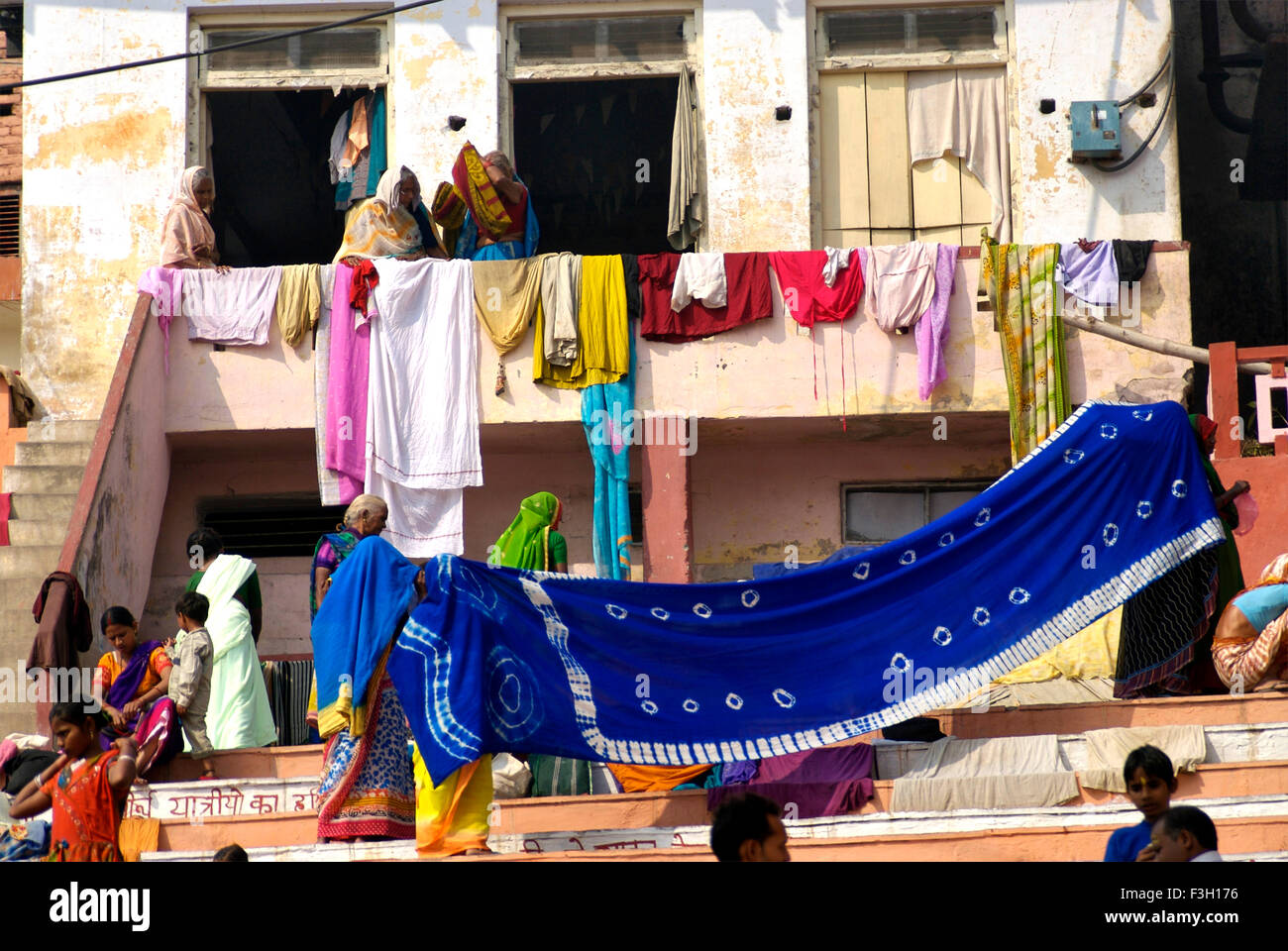 Women drying clothes, ganga ghat, varanasi, uttar pradesh, india Stock ...