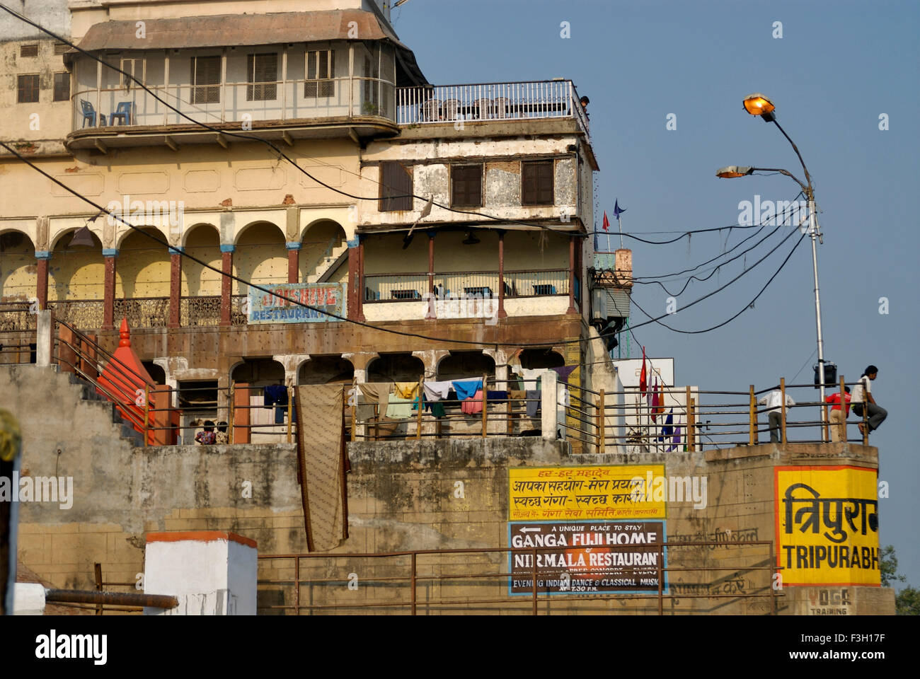 Building with glowing street lamps ; Varanasi ; Uttar Pradesh ; India ...