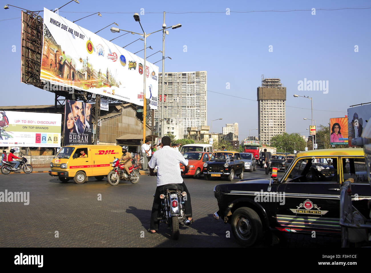 Mahalakshmi railway station & traffic on the road ; Bombay now Mumbai ...
