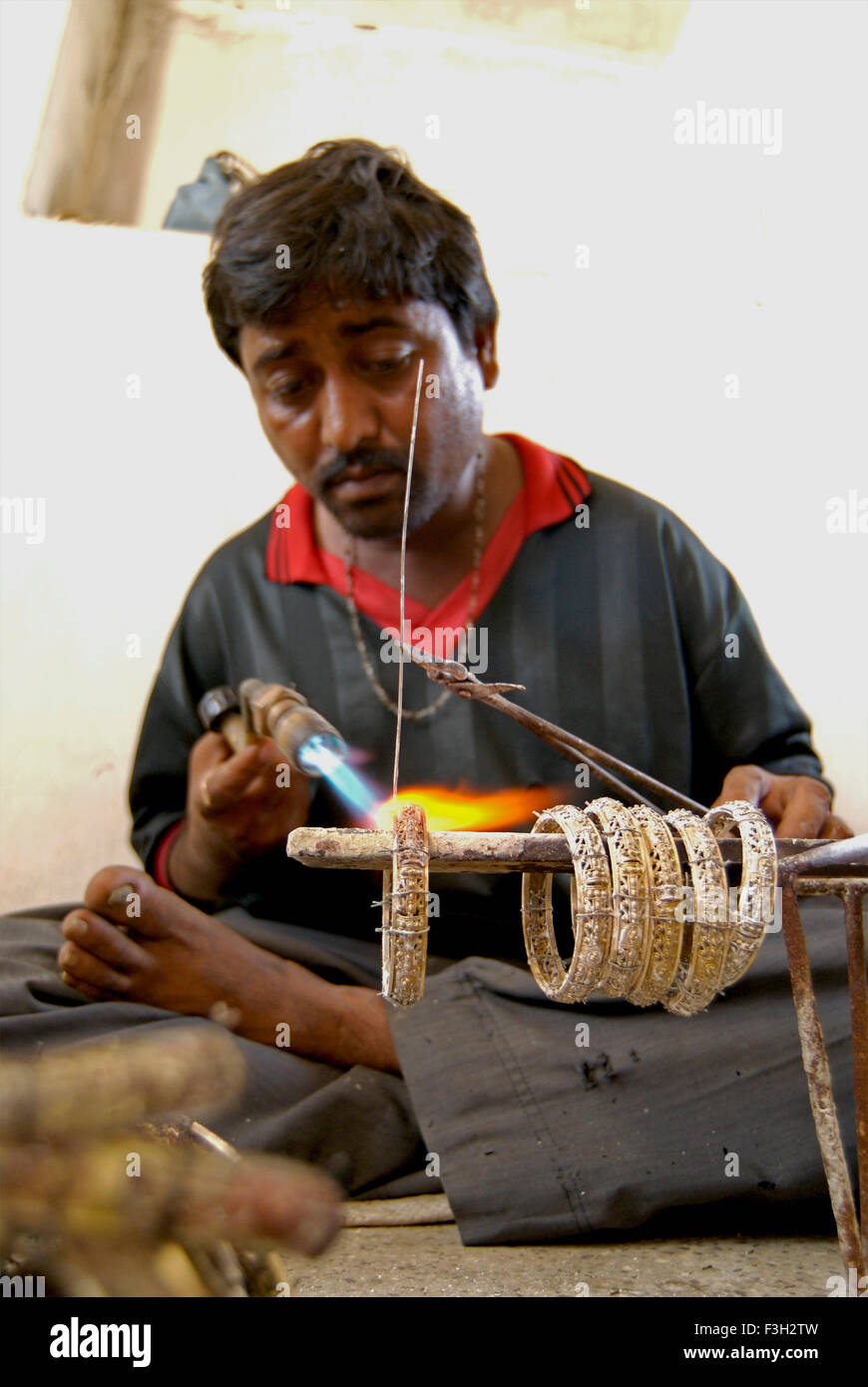 Man making brass bangles ; Rajkot ; Gujarat ; India Stock Photo - Alamy