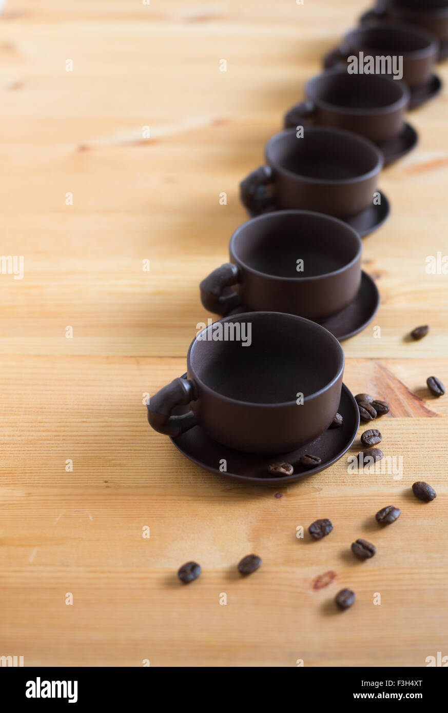 clean empty cups of coffee on a wooden background Stock Photo - Alamy