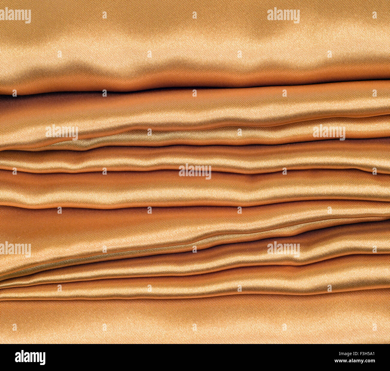 Gold Satin Background With Folds Stock Photo - Alamy