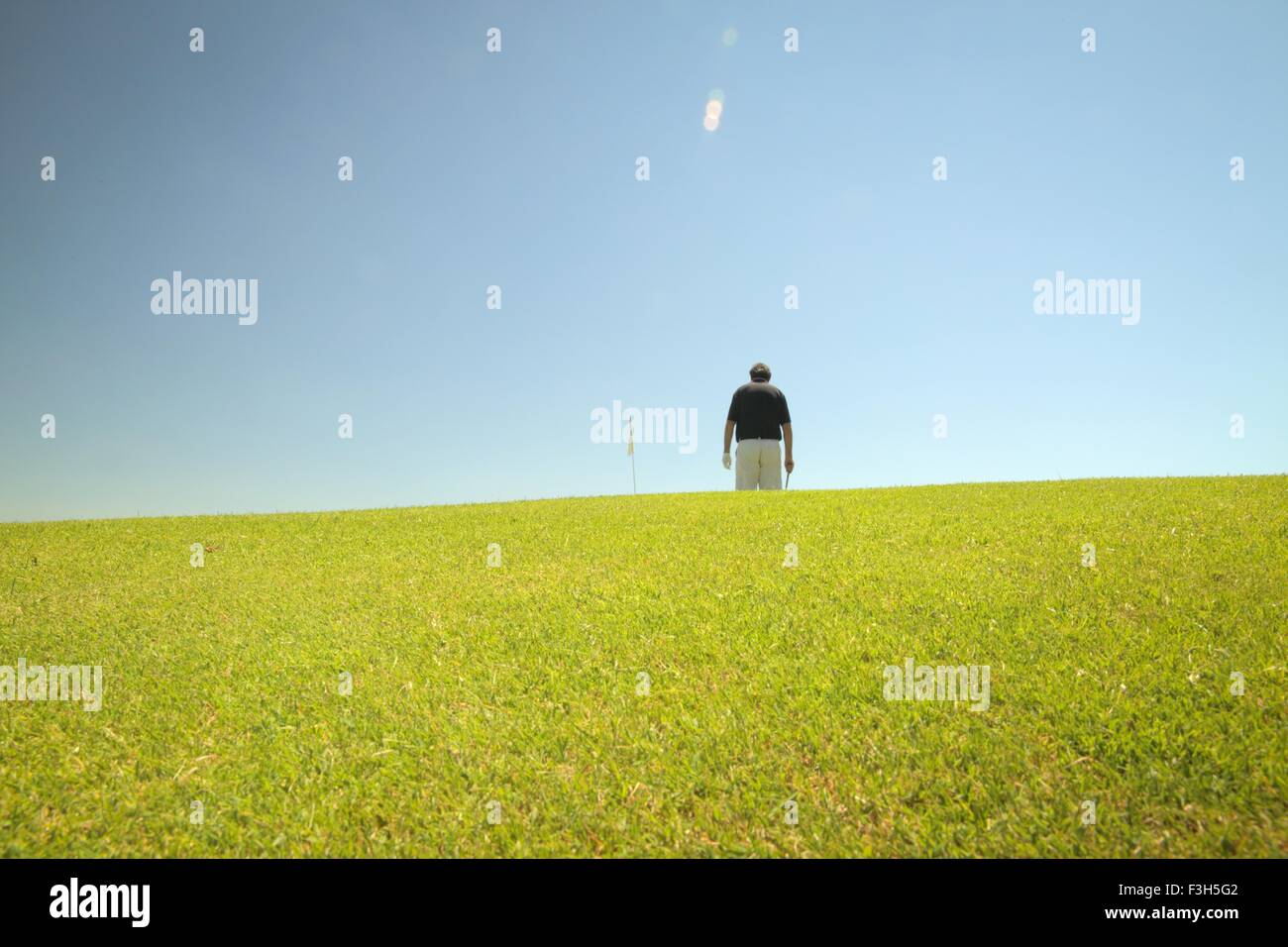 Mature man standing rear view hi-res stock photography and images - Alamy