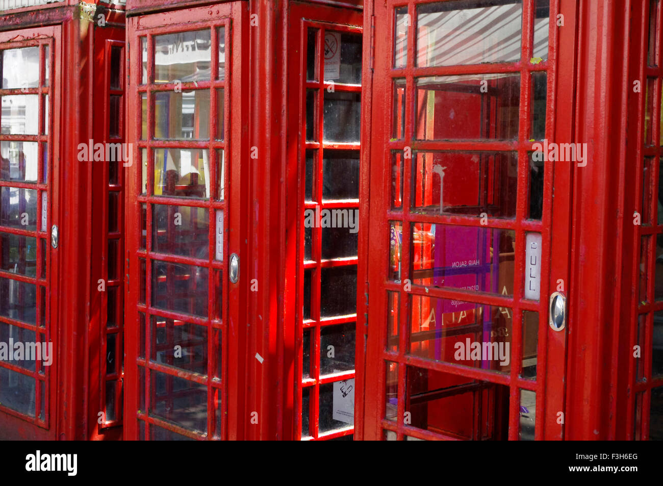 Three traditional British phone boxes Stock Photo - Alamy