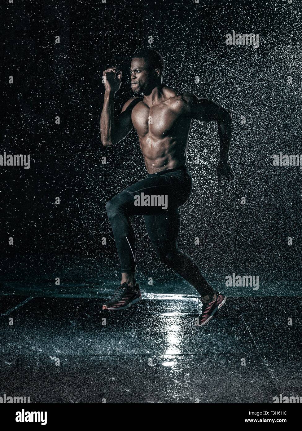 Man Running In The Rain Stock Photos & Man Running In The Rain Stock ...