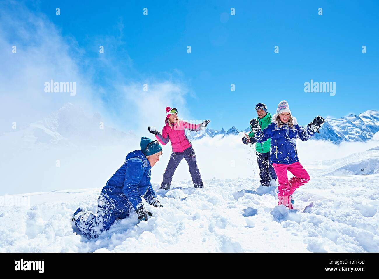 Family having snowball fight, Chamonix, France Stock Photo - Alamy