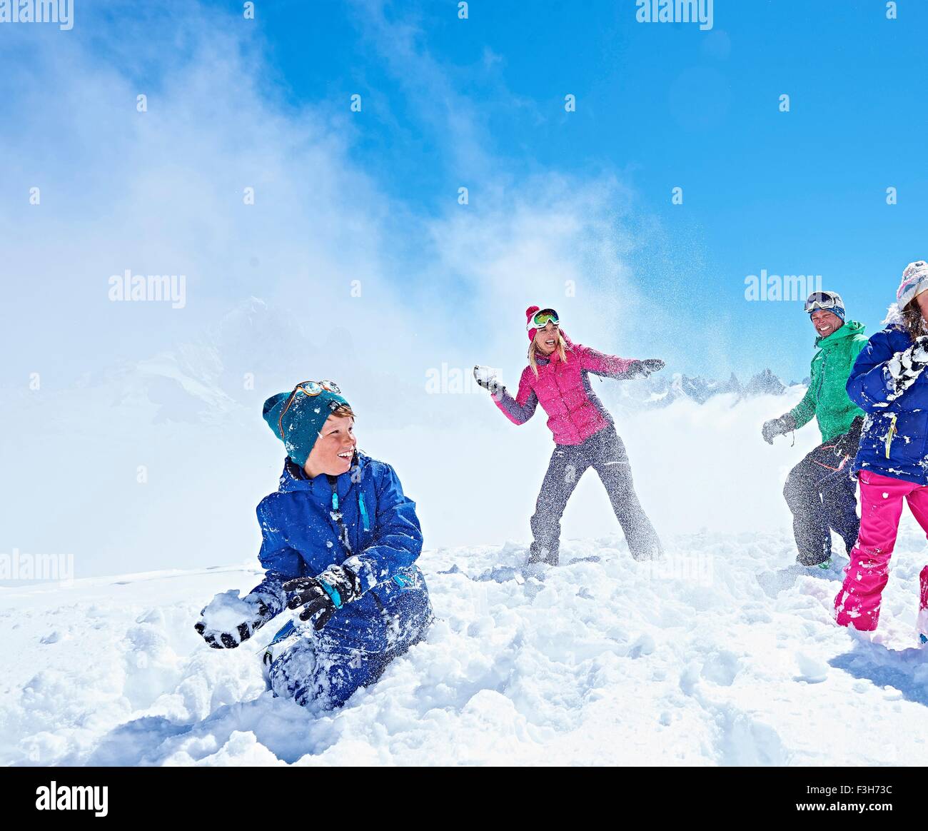 Family having snowball fight, Chamonix, France Stock Photo - Alamy
