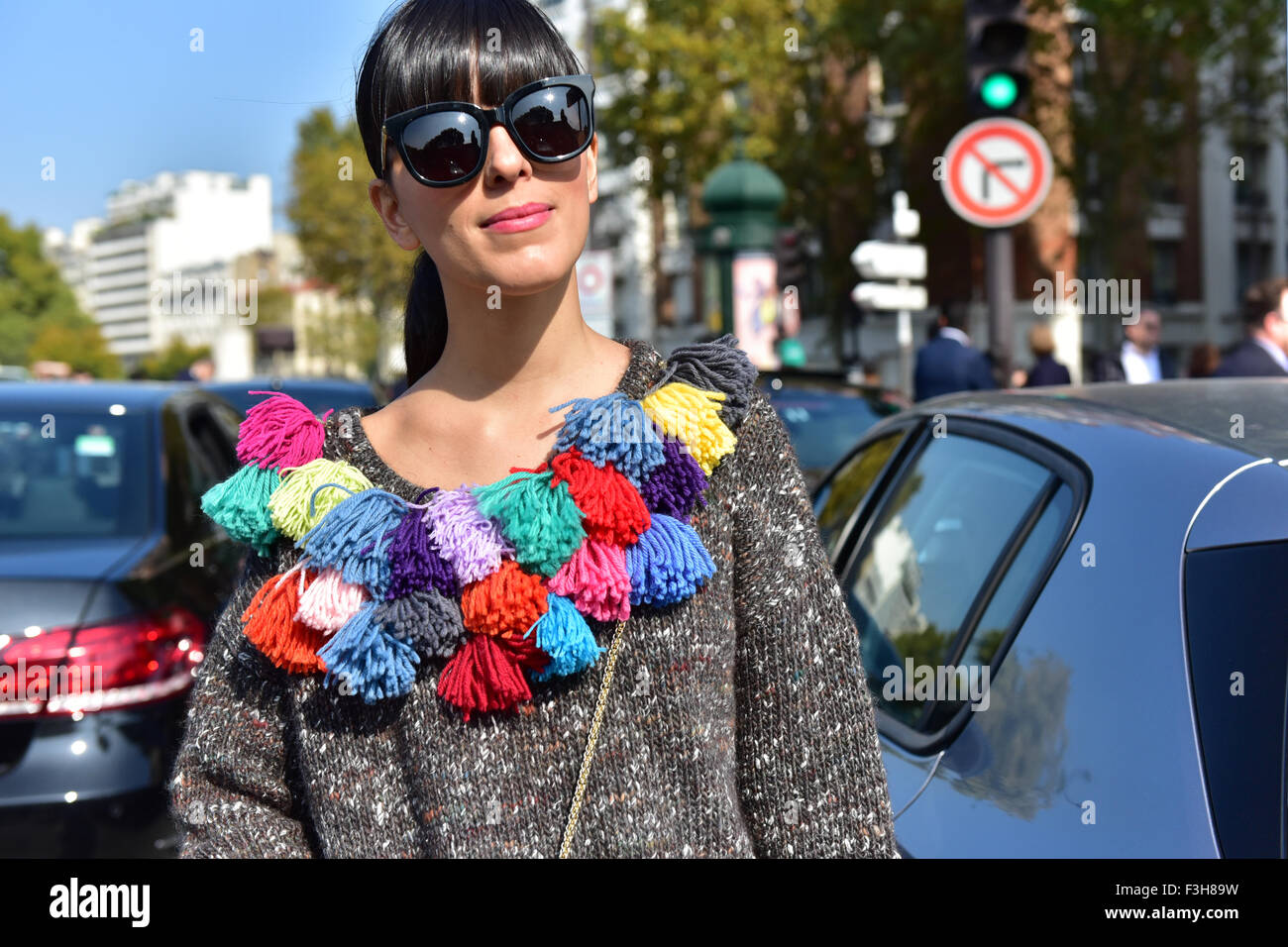 Blogger Laura Comolli posing outside of the Celine runway show during ...