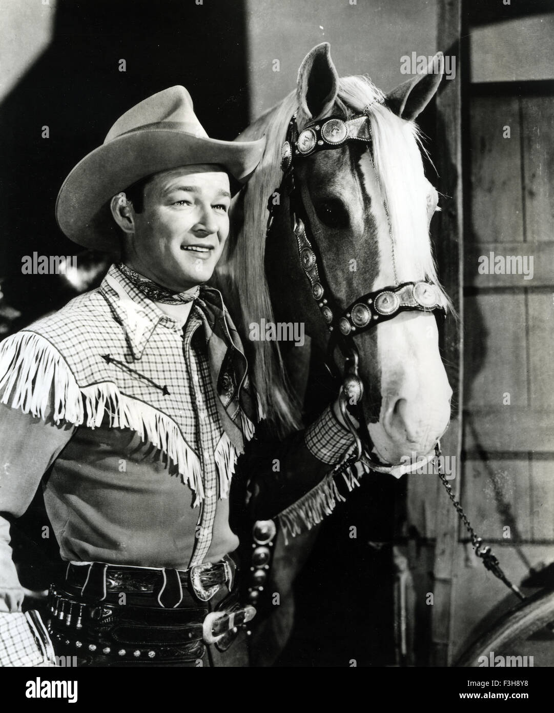 ROY ROGERS (1911-1998) US singer and cowboy actor with his horse ...