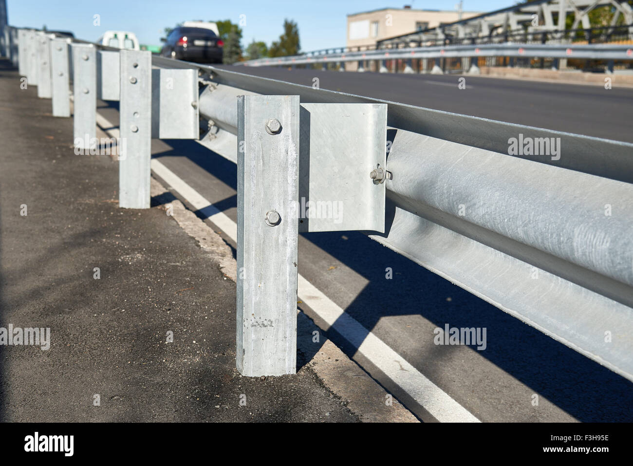 Anodized safety steel barrier on freeway bridge Stock Photo - Alamy