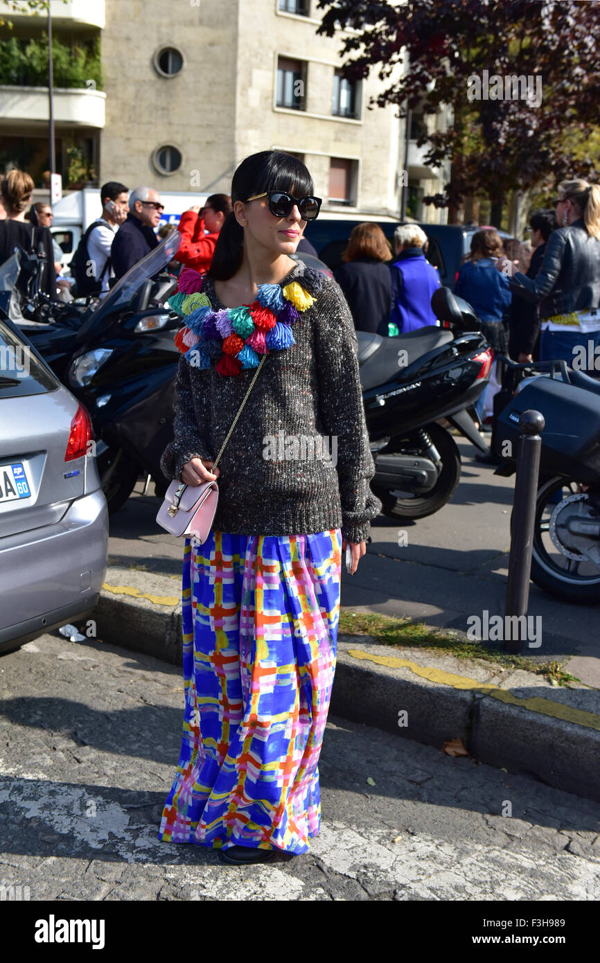 Blogger Laura Comolli posing outside of the Celine runway show during ...